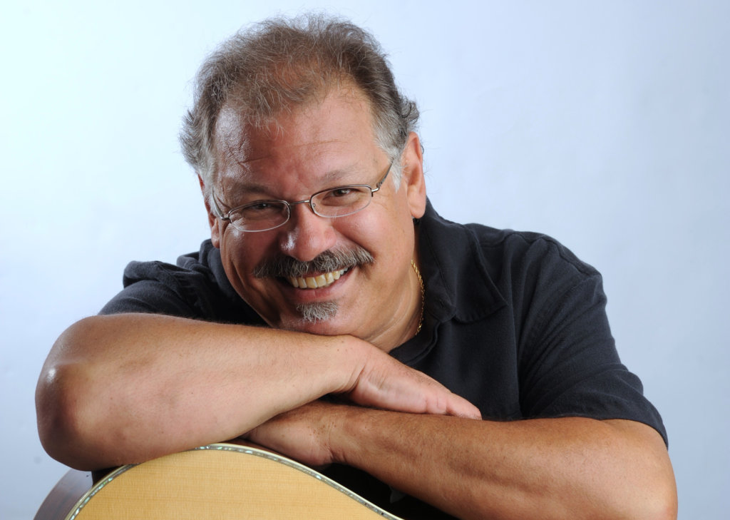 Denny Breau taking the stage at Farmington concert series