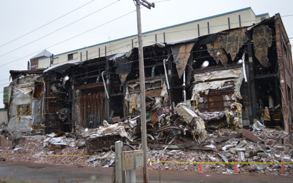 Crews tear down Otis paper mill steam plant