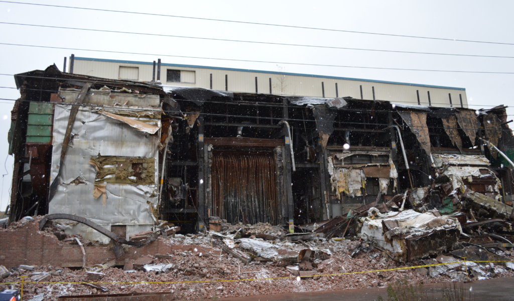 Crews tear down Otis paper mill steam plant